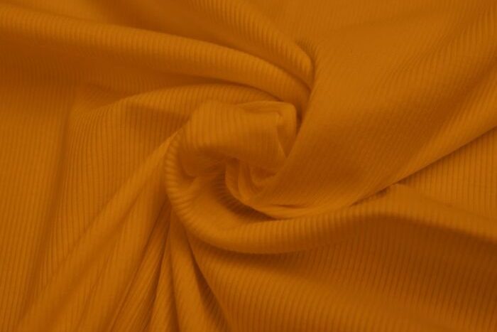Jersey rib stof in het oker geel. - Bestel op Stoffendorp.nl
